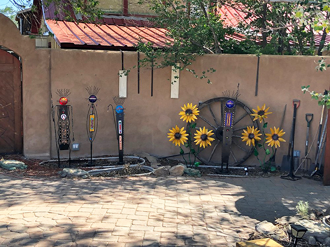 Garden art with southwestern flair—old tools transformed into sunflowers and figures, proving Madrid's creative spirit extends beyond gallery walls.
