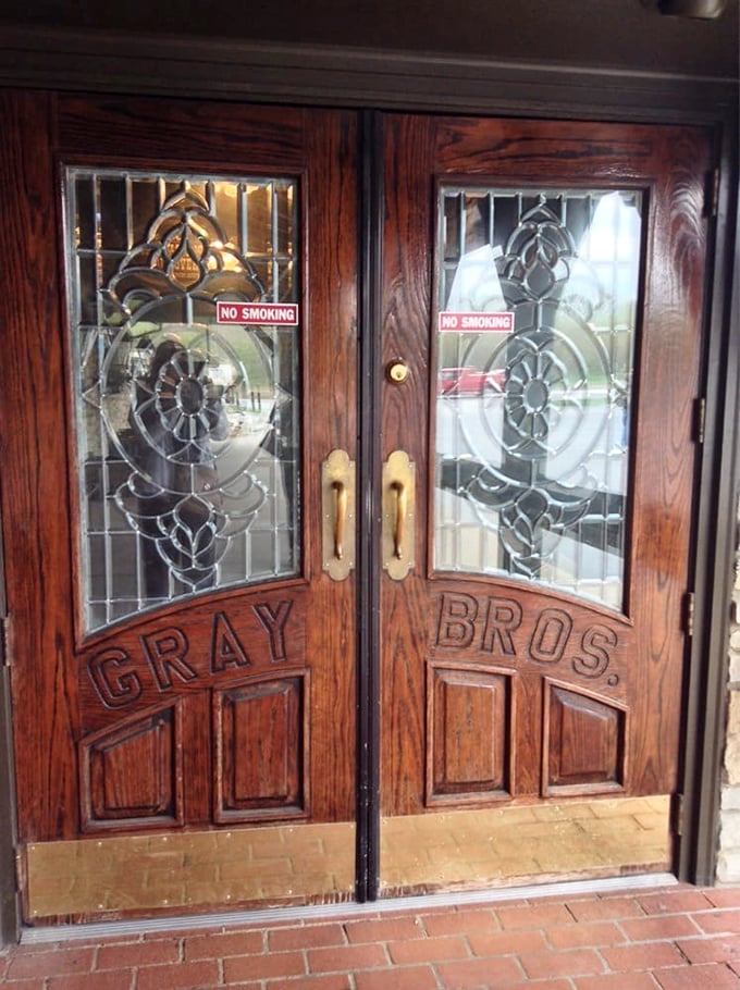 Those carved wooden doors aren't just an entrance to a restaurant—they're a portal to a disappearing America where food was honest and plentiful.