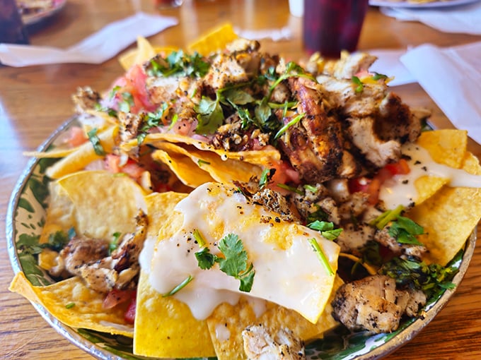 These nachos aren't just topped—they're smothered with a generosity that suggests the kitchen knows exactly what you're craving.