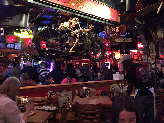Where motorcycle culture meets dining innovation. The skeleton rider suspended above the crowd perfectly encapsulates The Vortex's "live dangerously, eat gloriously" philosophy.