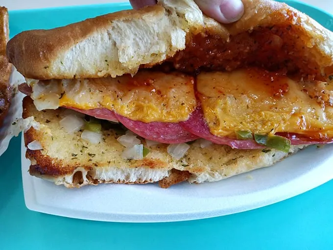 That sandwich isn't just lunch—it's architecture. Layers of Italian goodness stacked with the precision of a Jenga master.