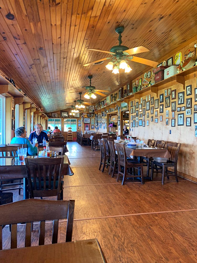 The dining room hums with conversation and clinking silverware, while ceiling fans lazily spin above tables of happy diners making memories.