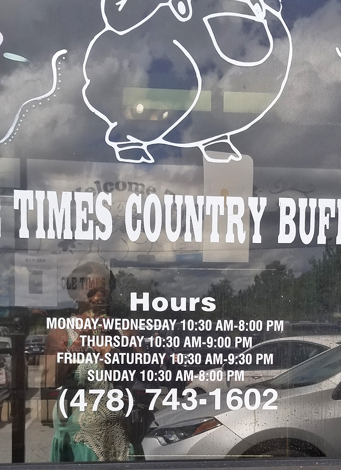 The hours of operation displayed on the door – crucial information for planning your stretchy-pants expedition to this temple of Southern cuisine.