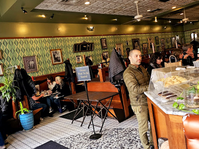 The dining room hums with the energy of satisfied customers. Those wooden booths have supported countless elbows during "just one more bite" moments.