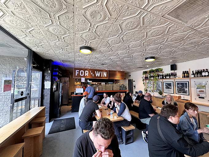 The dining room buzzes with the universal language of burger appreciation—head-nodding, occasional moans, and the silence of serious eating.