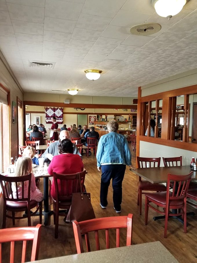 The dining room buzzes with the universal language of satisfied eaters—forks clinking, heads nodding, and not a cell phone in sight.