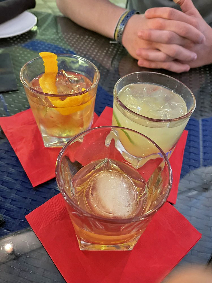 The holy trinity of craft cocktails—each glass a different personality, like meeting three fascinating strangers at a dinner party.