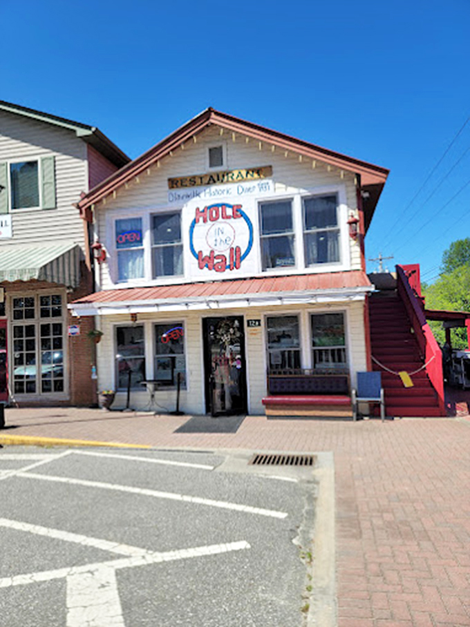 The cream-colored exterior with its distinctive red trim stands as a landmark for hungry travelers—breakfast salvation is just steps away.