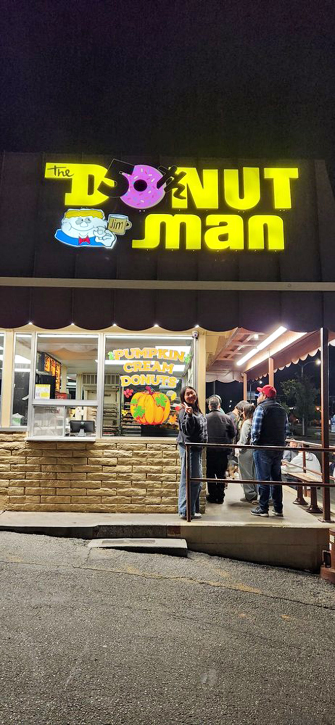 The neon sign glows like a lighthouse for night owls and early birds alike—guiding hungry souls to donut salvation.