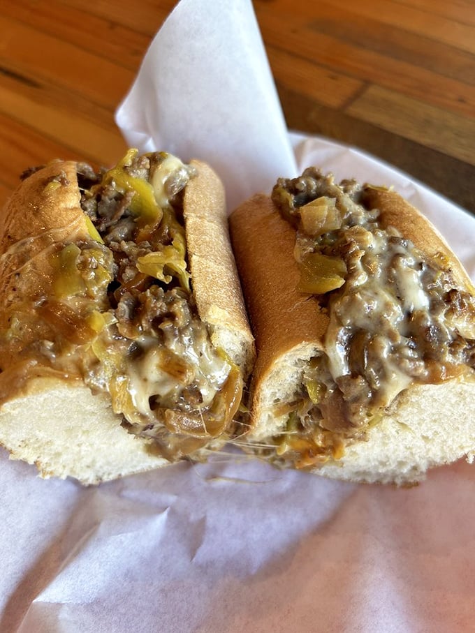 Behold the cross-section that launched a thousand cravings—where beef, cheese, and onions achieve a mouthwatering trinity.