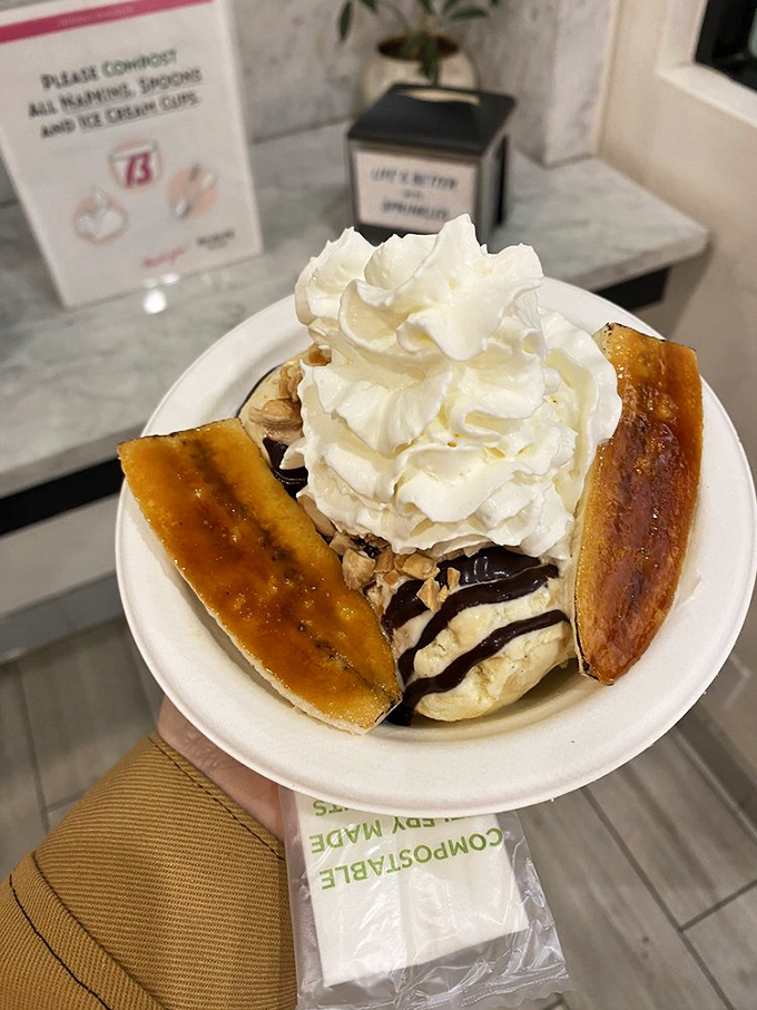 Caramelized bananas, whipped cream, and hot fudge create a sundae worth writing home about. Spoons up for this architectural marvel.