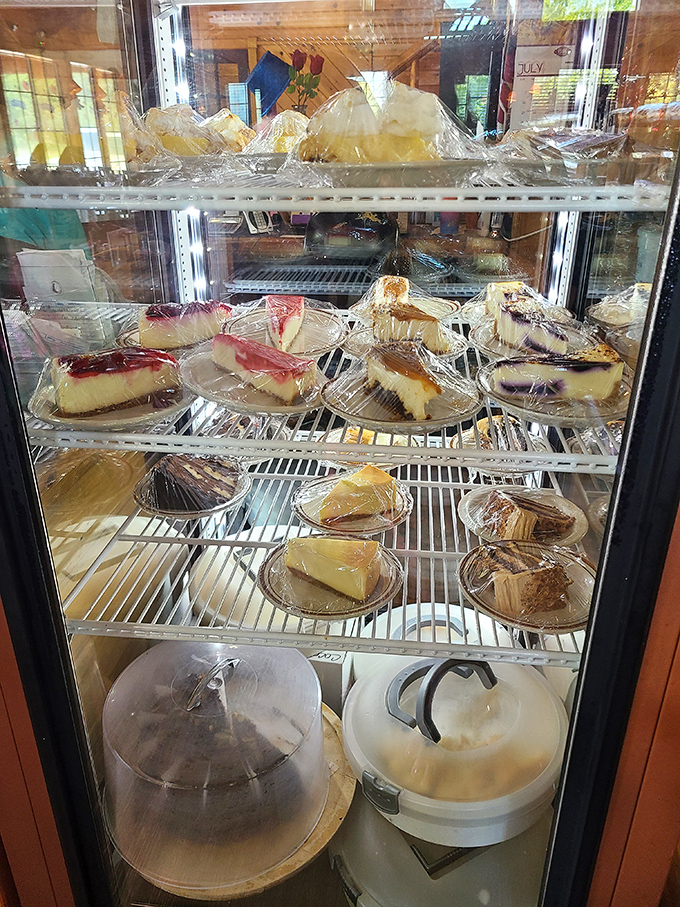 The dessert case: where willpower goes to die a happy death. Each slice isn't just dessert—it's the reason elastic waistbands were invented.