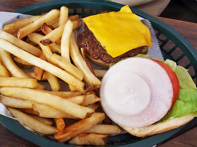 The cheeseburger—America's most perfect food invention. This one keeps it classic: good beef, melty cheese, fresh veggies, and those hand-cut fries.
