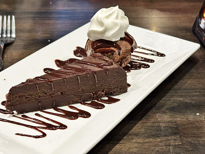 Chocolate torte that doesn't just end your meal—it provides closure with a standing ovation of cocoa. 