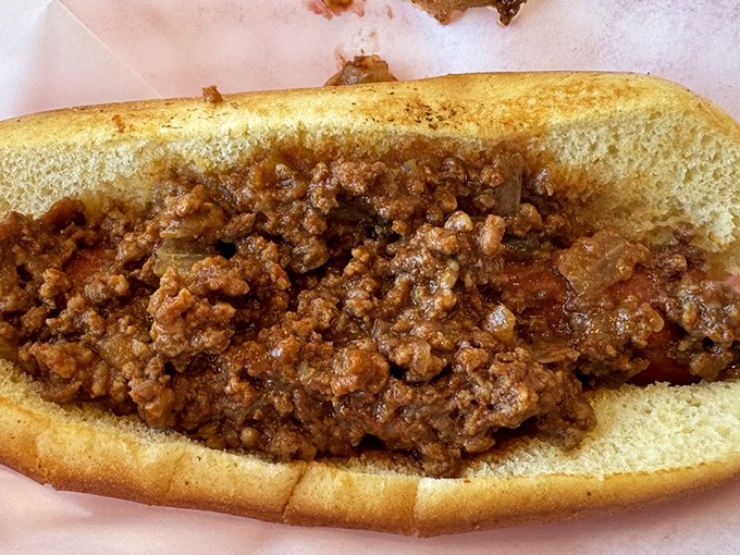 The Coney dog doesn't need fancy toppings to impress – its straightforward, meaty charm speaks a language everyone understands.