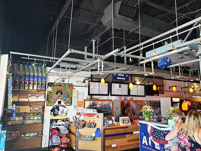 The heart of the operation where orders are dispatched with railway efficiency. Board games and train merchandise await while your food chugs its way from kitchen to table.