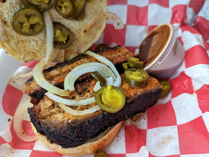 This pork belly sandwich with jalapeños isn't just food – it's edible poetry for people who prefer their sonnets with a kick.