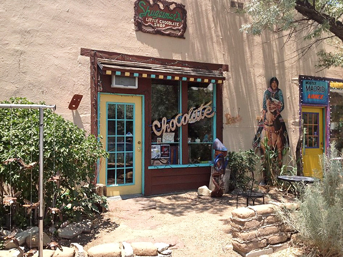 Shugarman's Little Chocolate Shop tempts passersby with its colorful facade and promises of handcrafted sweets—resistance is futile.