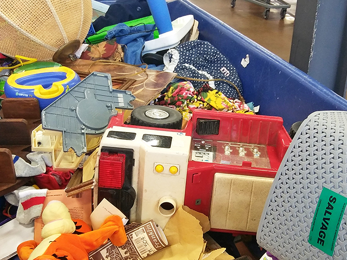Vintage toys and childhood memories nestled together – that red toy kitchen probably served countless pretend meals before arriving here.