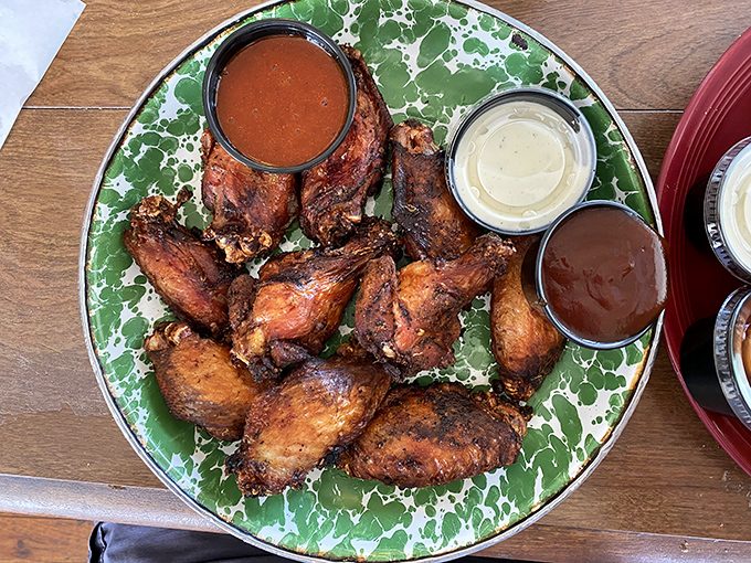 Wings that have clearly been introduced to smoke before being introduced to you—a proper three-way relationship with sauce.