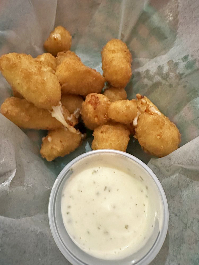 These cheese curds aren't just appetizers—they're little golden nuggets of joy that squeak their way into your heart.