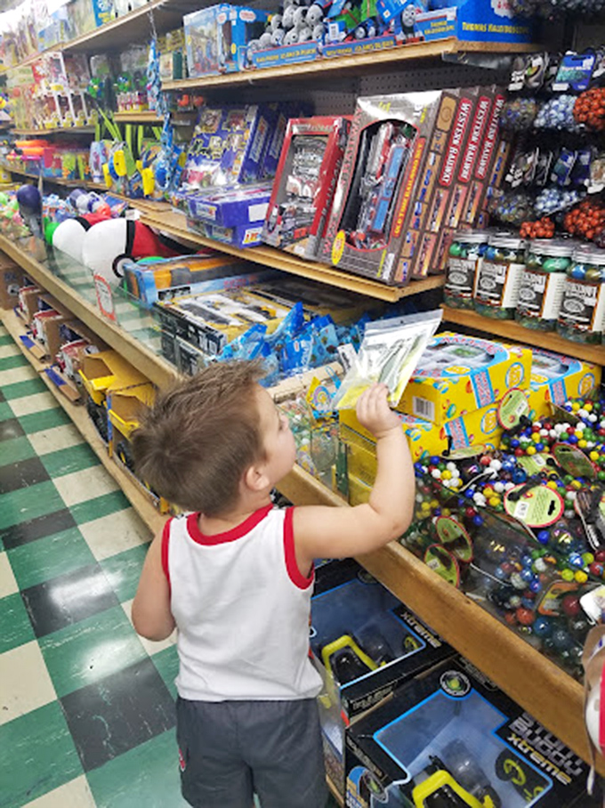 Childhood wonder captured in a single glance. This little explorer demonstrates the proper way to experience Dick's 5 & 10—with unbridled curiosity. 