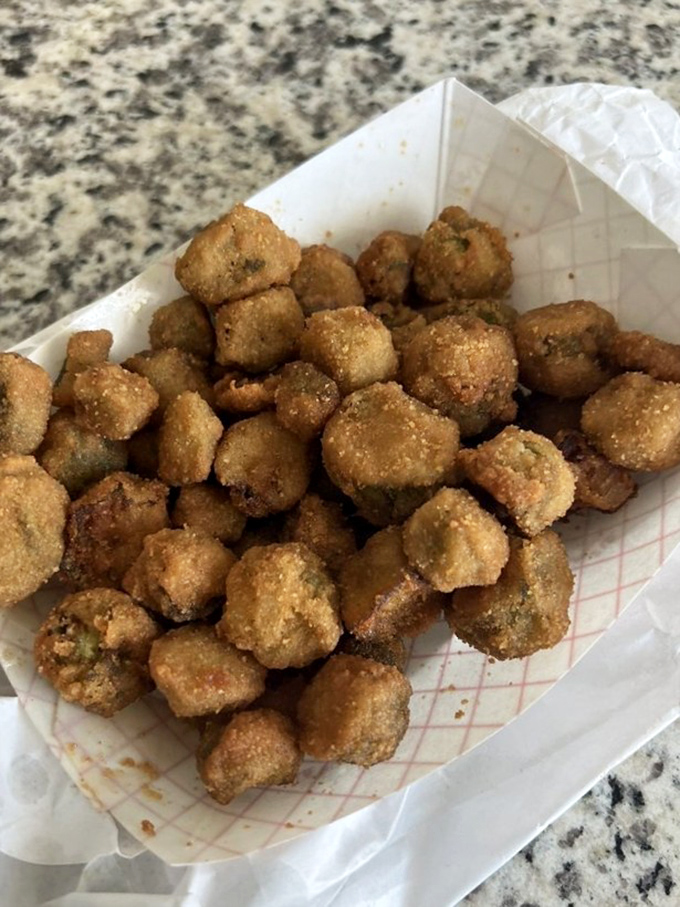 Fried okra nuggets offer the perfect Southern punctuation between bites of smoky meat—crispy, savory little flavor bombs worth fighting over.