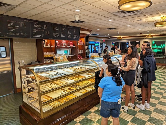 The bakery counter—where sweet dreams are made of guava pastries, and who am I to disagree? Join the line of pilgrims seeking sugar salvation.