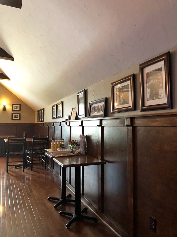 Dark wood paneling and tasteful framed prints create the dignified ambiance of a pub that's been standing for centuries—even if it hasn't.