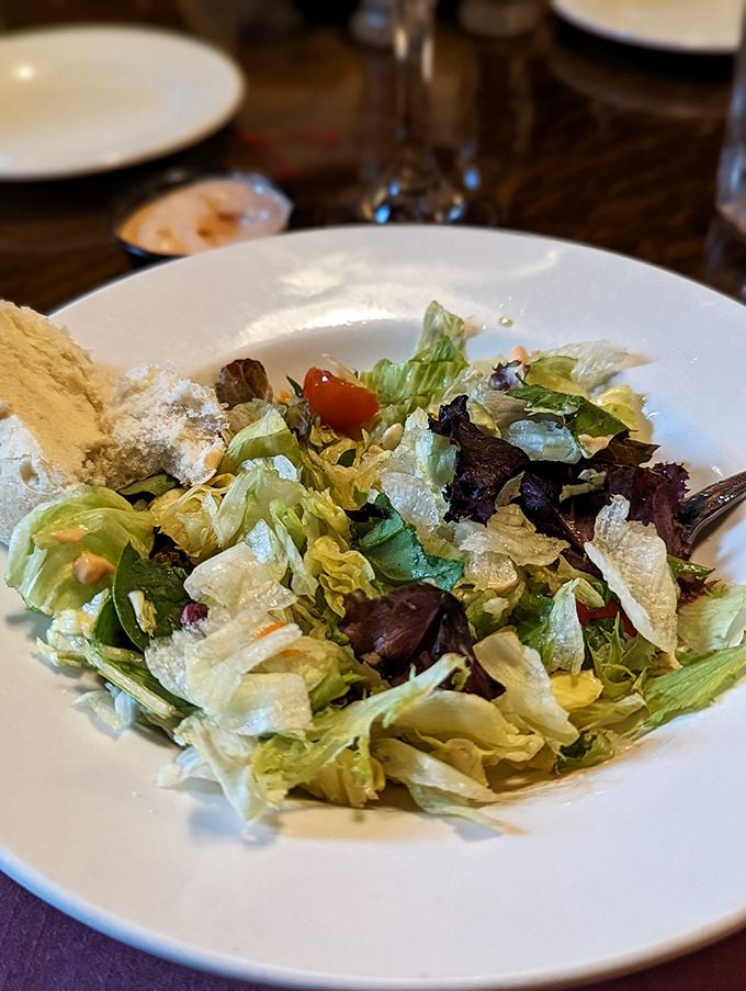 A salad that knows its place in the steakhouse hierarchy—fresh, crisp, and just enough to make you feel virtuous before the main event. 