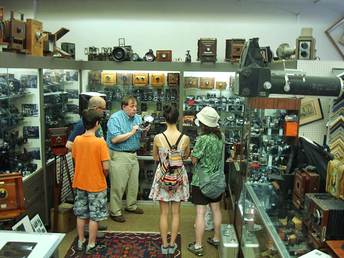 Knowledge being passed down as visitors discover the mechanical marvels that preceded our smartphone cameras. The look of wonder never changes!