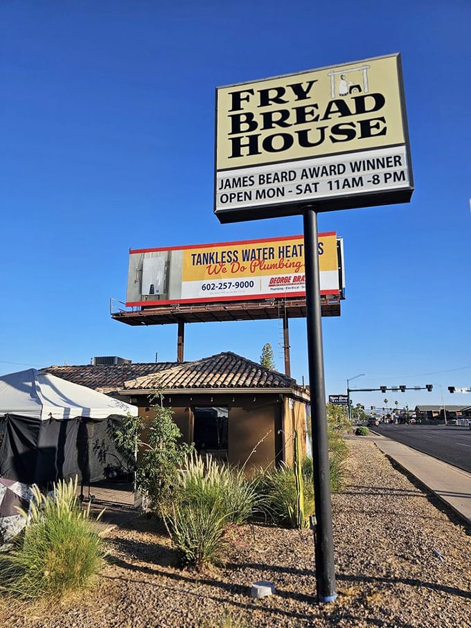 The sign proudly announces its James Beard credentials against the Arizona blue sky. This modest building houses one of Phoenix's most authentic culinary experiences.