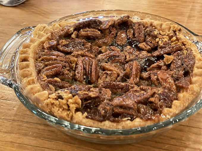 This isn't just pecan pie—it's a Southern diplomat in dessert form. Those nuts have arranged themselves in perfect formation, ready for your fork.