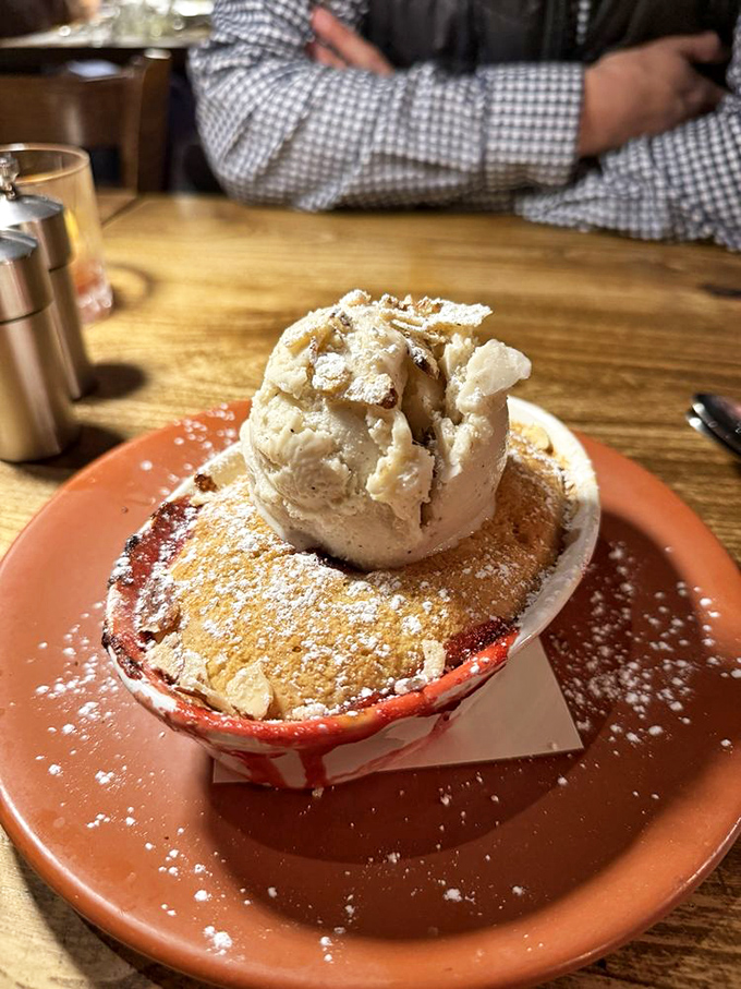 This strawberry shortcake with its crown of vanilla ice cream isn't just dessert—it's the grand finale your taste buds have been waiting for all night.