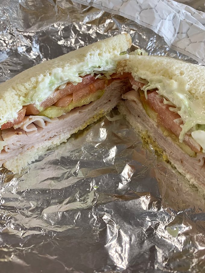 The cross-section reveals the truth: a proper sandwich requires generous layers. This isn't some skimpy chain offering—it's lunch with integrity.