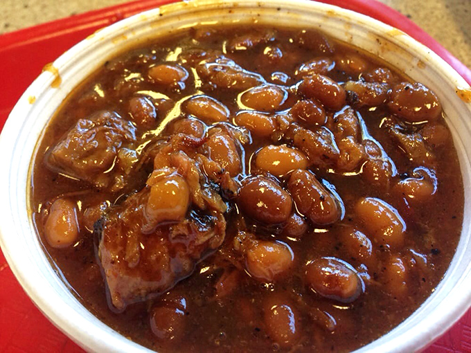 These baked beans—studded with meat and swimming in sauce-enriched goodness—aren't just a side dish; they're a supporting actor worthy of their own award.