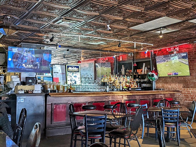 The bar area doesn't just serve drinks; it creates community. Those copper ceiling tiles have witnessed countless toasts, game-day cheers, and "one more round" decisions.