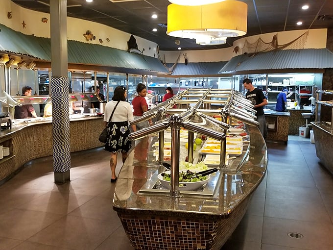 The buffet area where dreams come true and diets go to die. Notice how everyone's walking slowly, plotting their strategy like generals before battle.