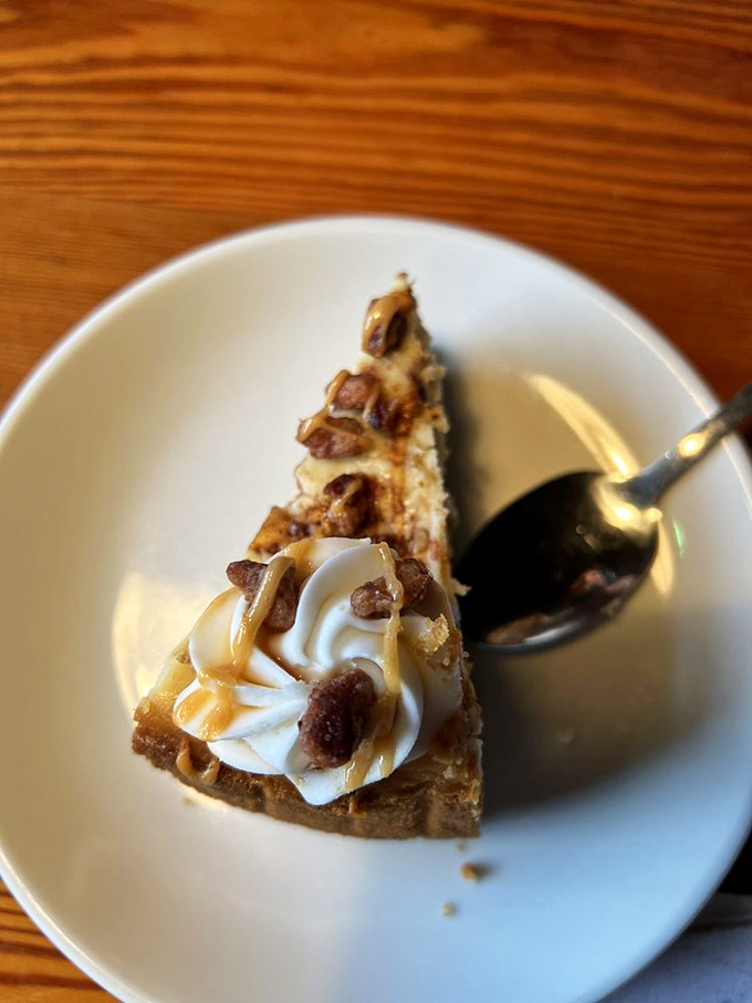 Not your ordinary dessert—this slice of heaven proves pirates have a sweet tooth too. Creamy cheesecake topped with caramel and pecans is worth hoarding.
