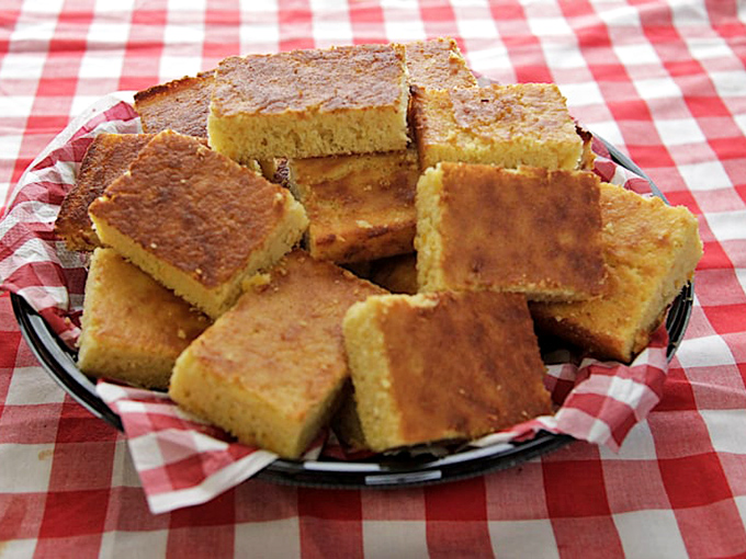 Cornbread squares that hover in that magical space between cake and bread—golden-topped, butter-ready, and absolutely non-negotiable with any barbecue order.