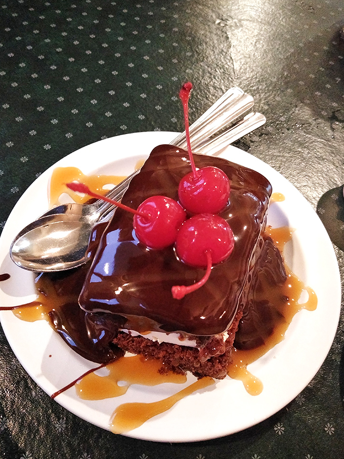 Chocolate cake that doesn't know the meaning of restraint, topped with cherries that seem to wink at you with sweet promises.
