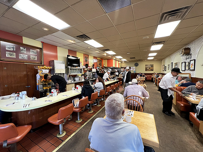 The neon sign doesn't just advertise waffles—it promises the kind of authentic breakfast experience that's becoming California's most precious resource. 