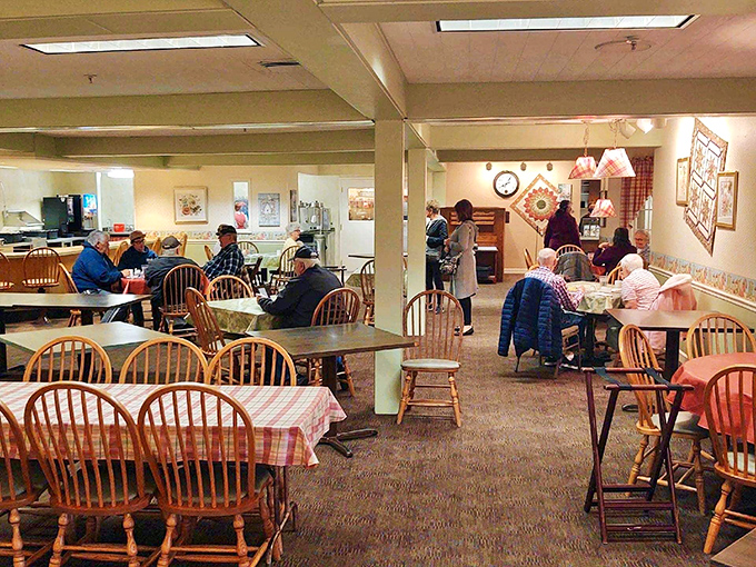 The dining room where strangers become friends over shared nods of approval. Simple furnishings focus attention where it belongs—on the food.