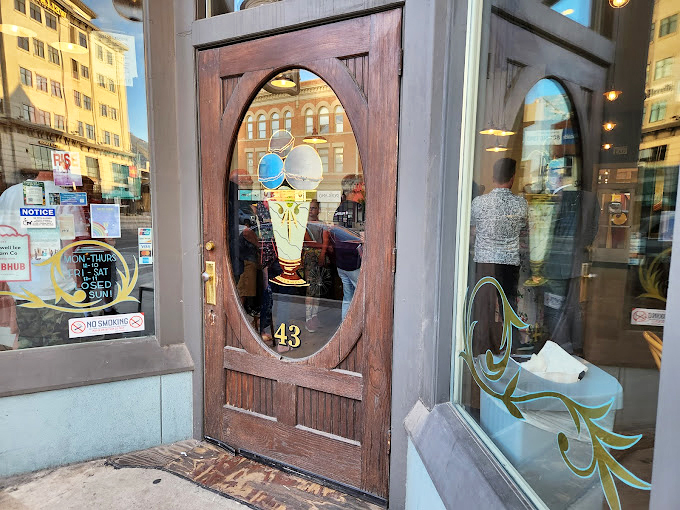 The iconic doorway with its oval window and ice cream cone insignia—a portal to happiness that's worth the pilgrimage.