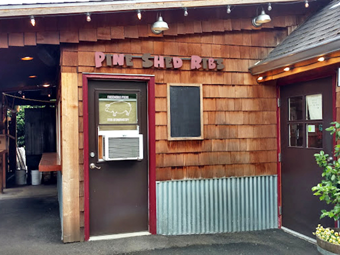 The entrance to meat paradise. That window air conditioner is working overtime against the heat of smoking meats and customer enthusiasm.