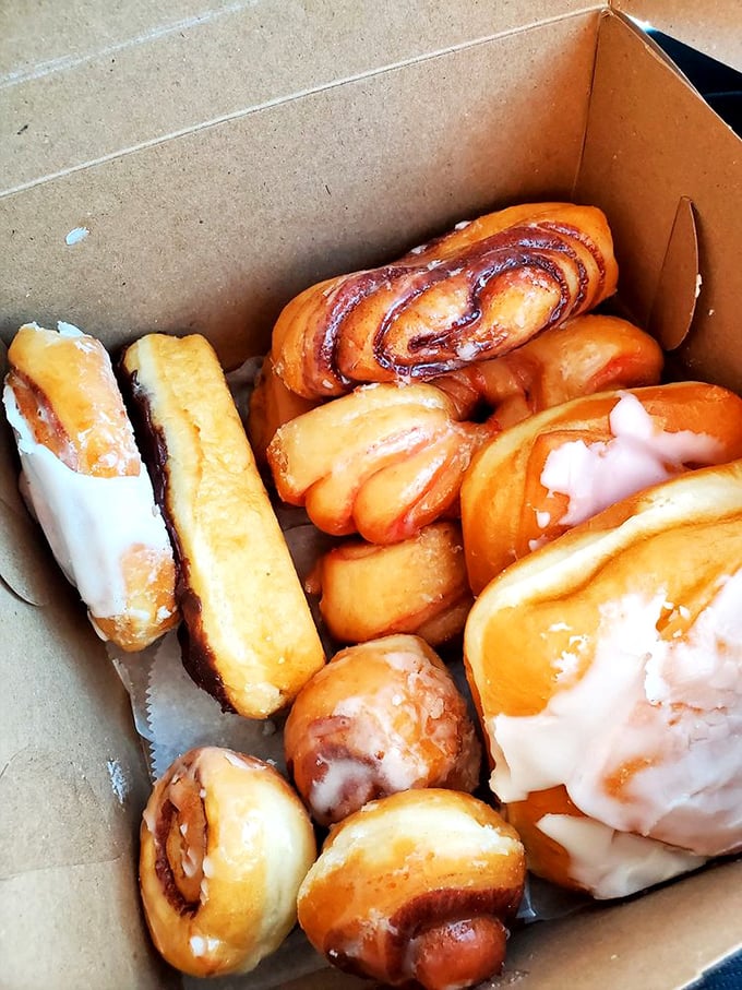 Not so much a box of donuts as a treasure chest of possibilities – each one promising a moment of sweet escape.