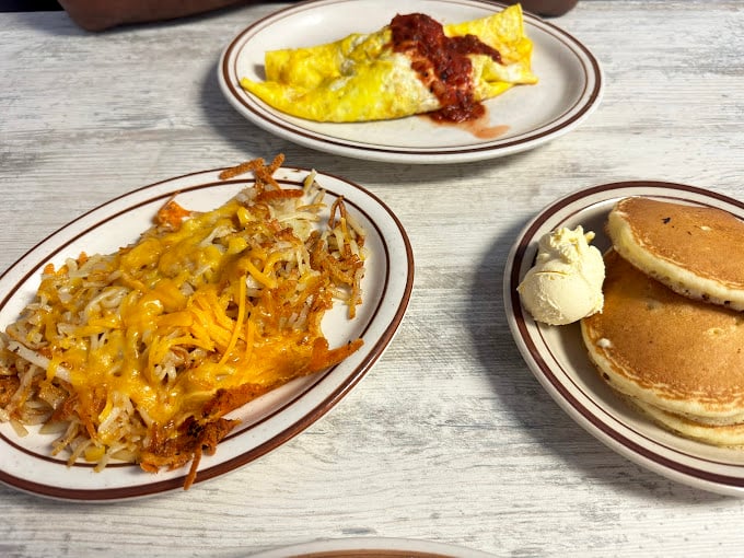 Those hash browns aren't just crispy and cheesy—they're the supporting actor that steals the show on a plate of breakfast perfection.