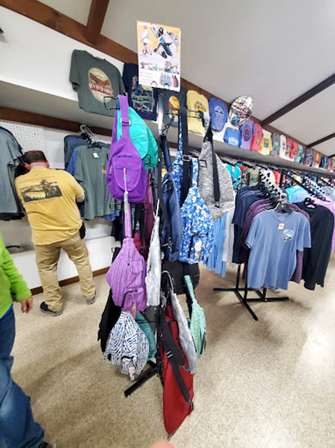 Wearing West Virginia pride! The t-shirt wall offers stylish ways to remember your mountain adventure long after you've returned home.