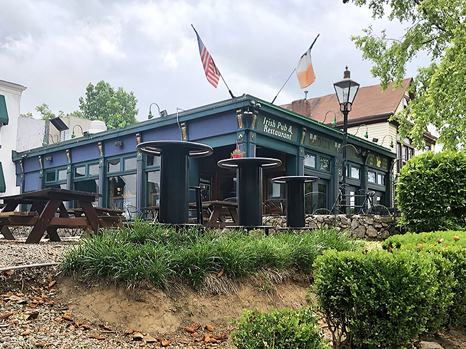 The distinctive blue exterior of Molly Malone's stands proudly in Louisville's Highlands, flying both American and Irish flags—a Celtic oasis in Kentucky bourbon country.