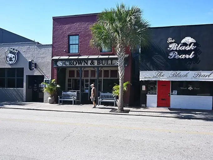 Downtown Dunedin's charm on full display – brick buildings, palm trees, and local shops like Crown & Bull create that perfect "I could live here" feeling.